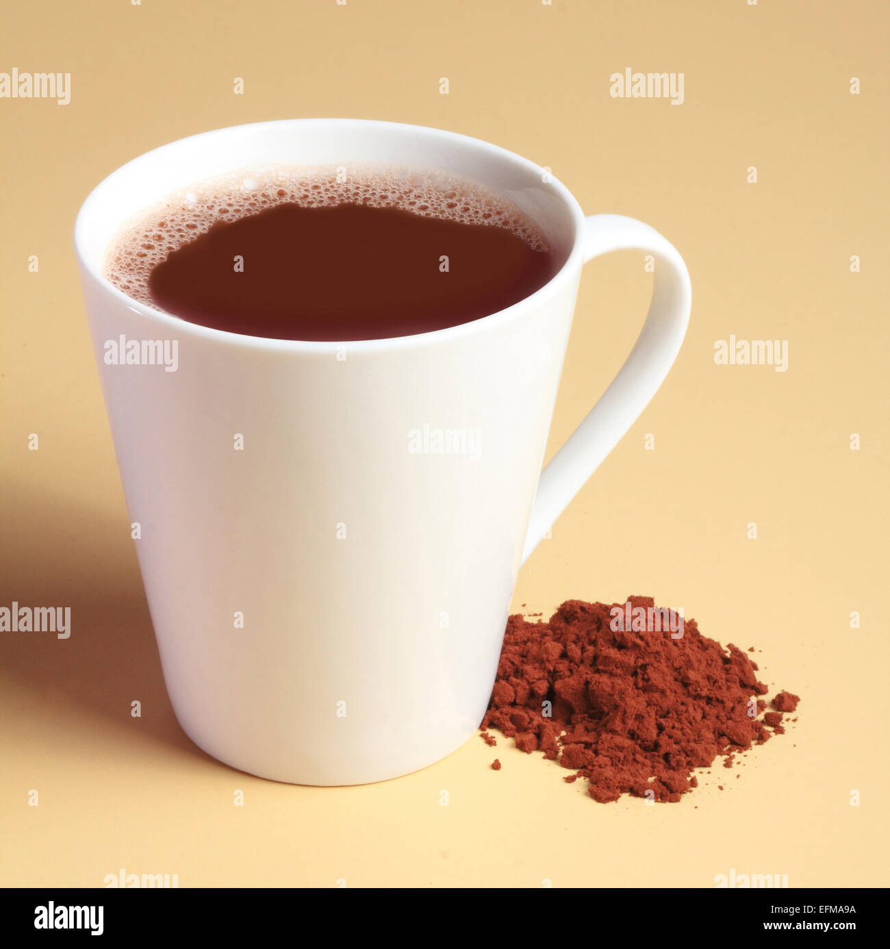Hot chocolate drink and chocolate powder on simple yellow background ...