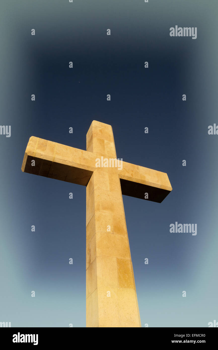 Large stone cross against a blue and white background Stock Photo - Alamy