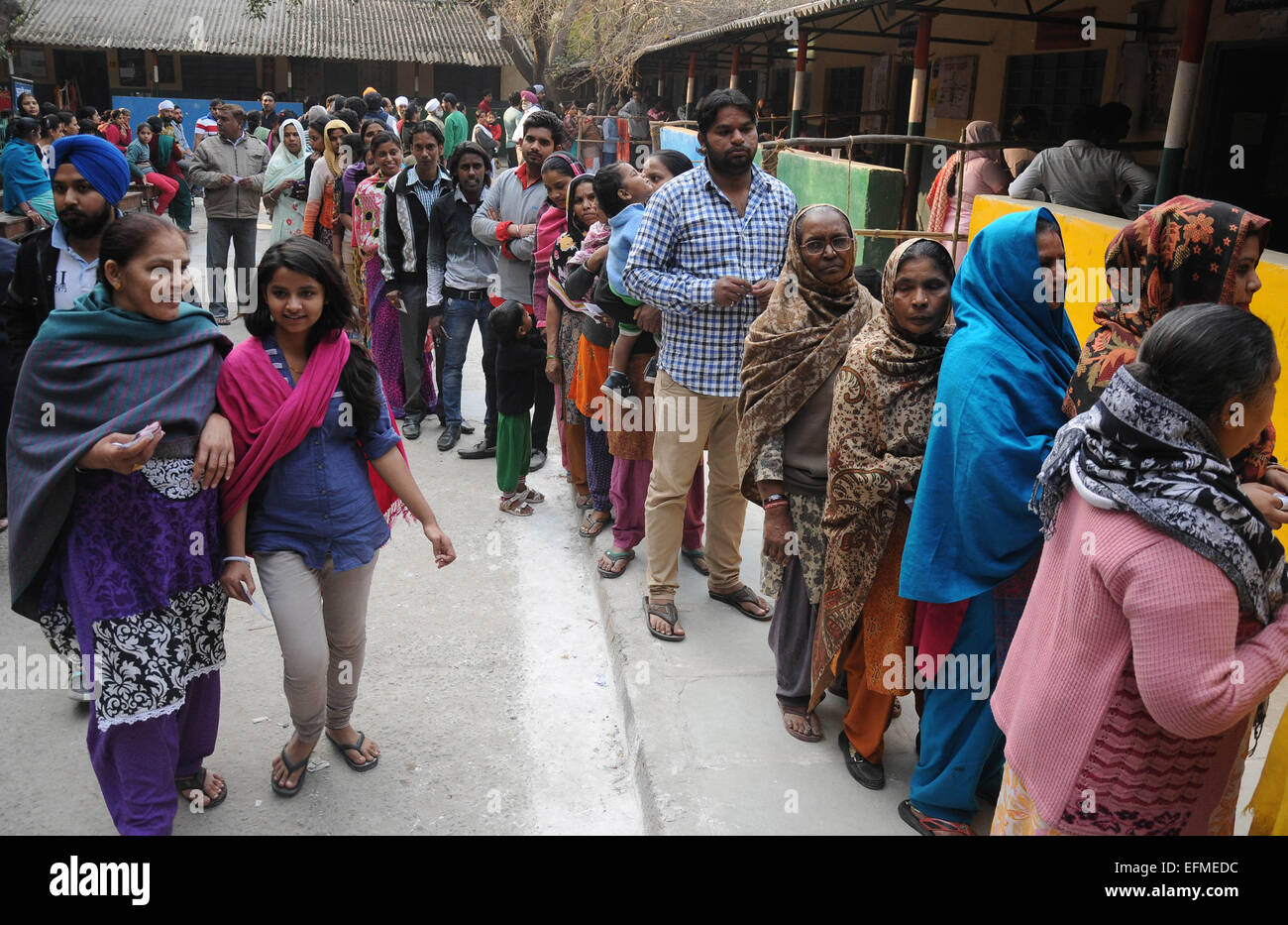 New Delhi, India. 7th Feb, 2015. People stand in a queue at a polling ...