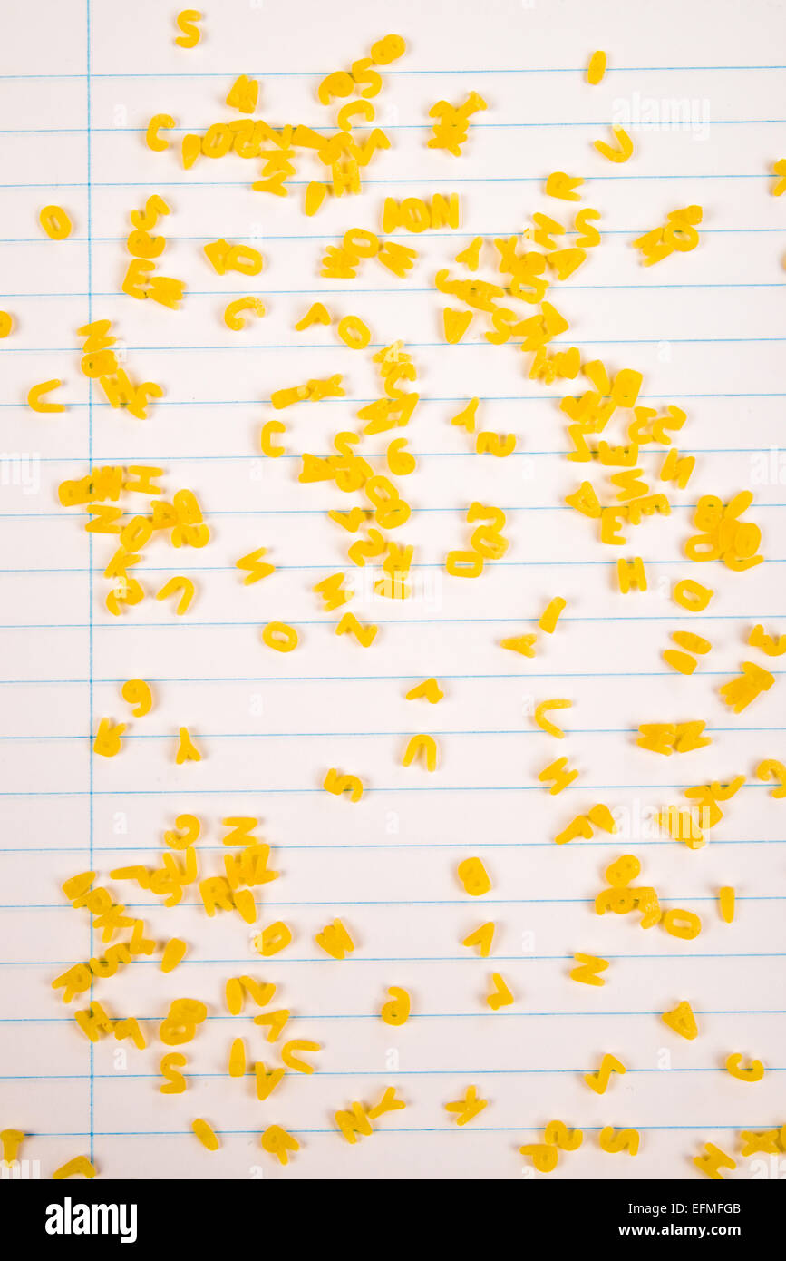 Notebook with scattered pasta letters, a school concept Stock Photo - Alamy