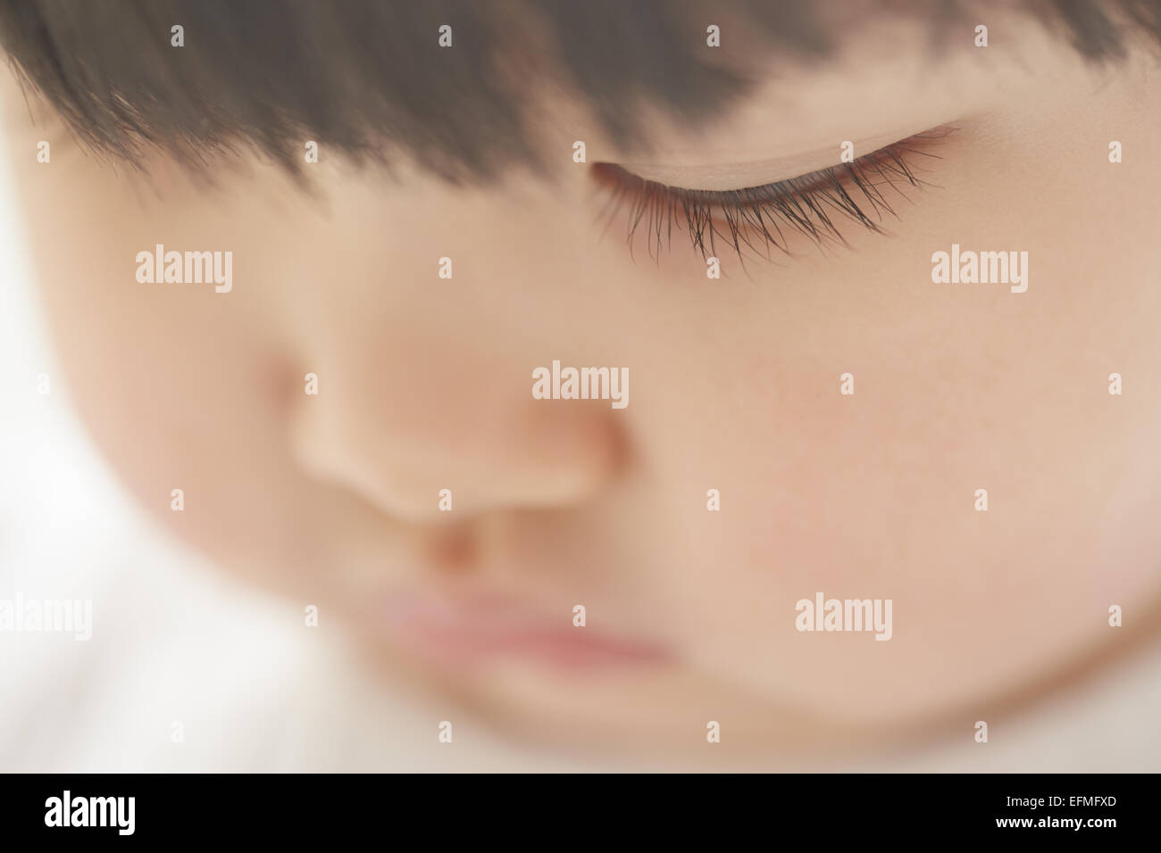 Close-up photo of pensive child looking down Stock Photo - Alamy