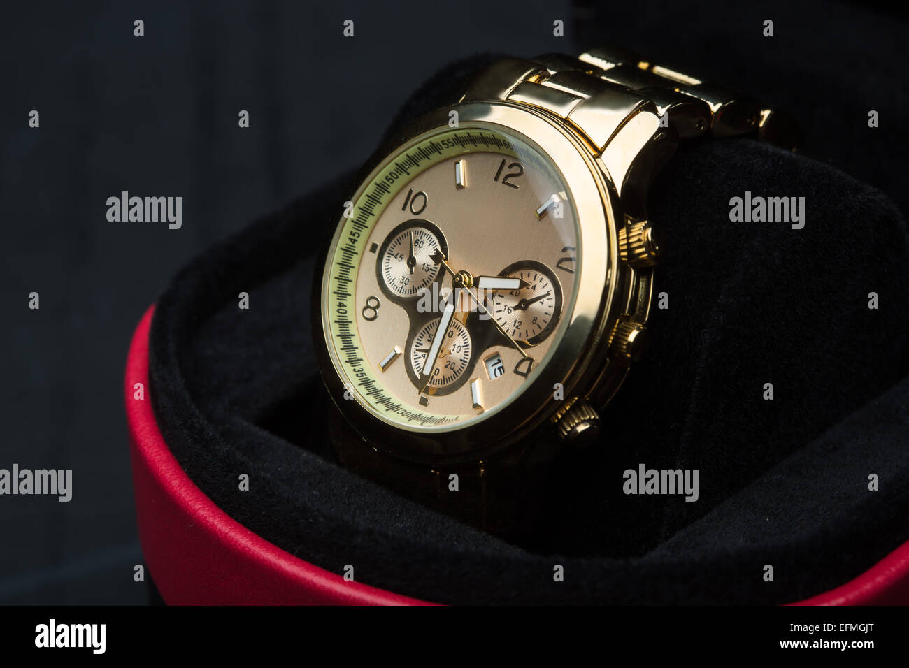 gold watch isolated on black background Stock Photo - Alamy