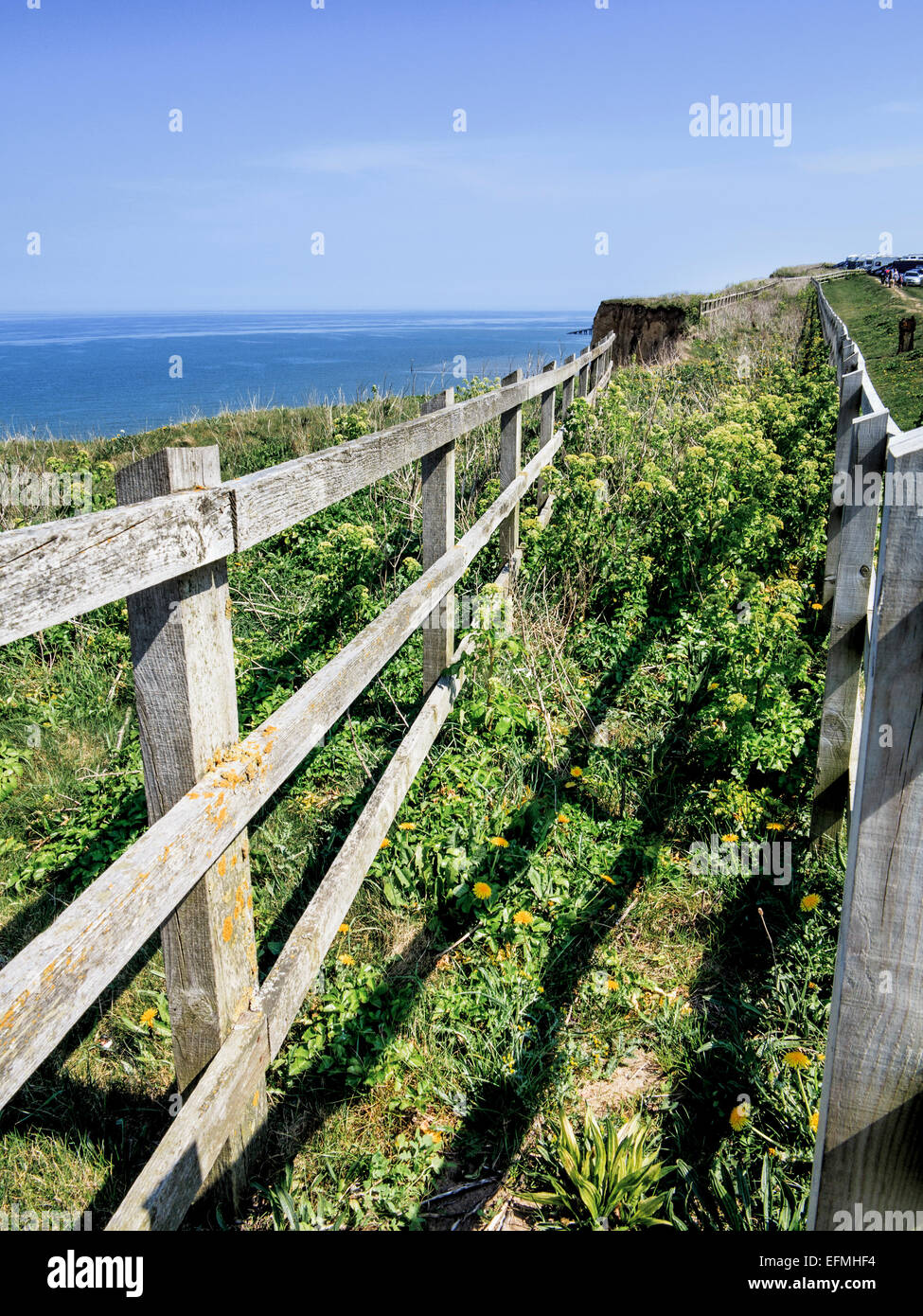 Fence on cliff edge Stock Photo - Alamy