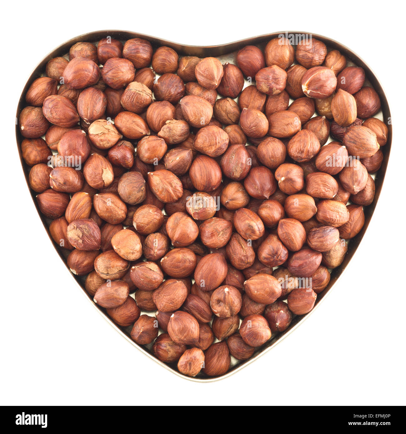 Heart shaped box full of hazelnuts Stock Photo - Alamy