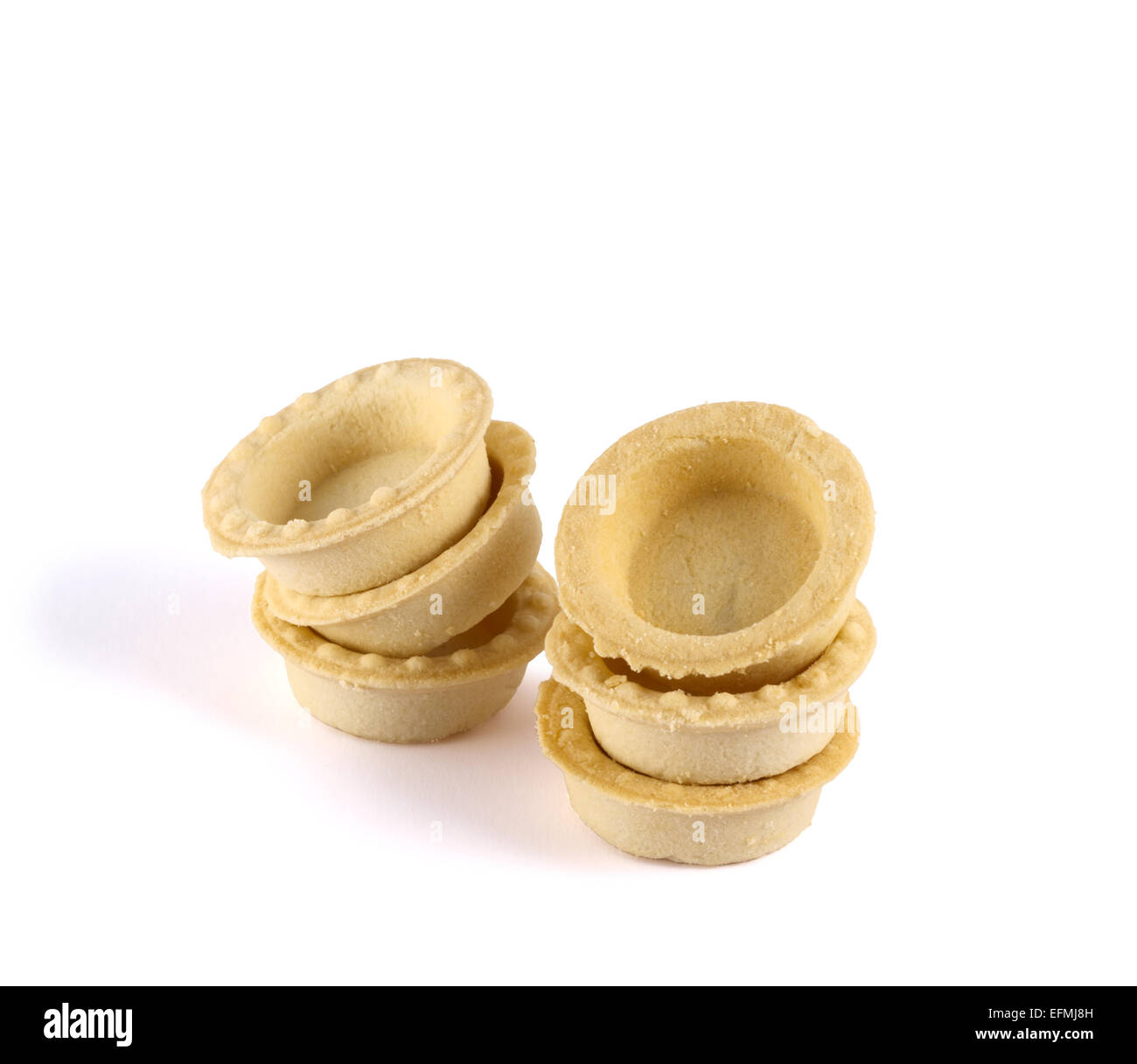 Pile of empty tartlets isolated Stock Photo - Alamy