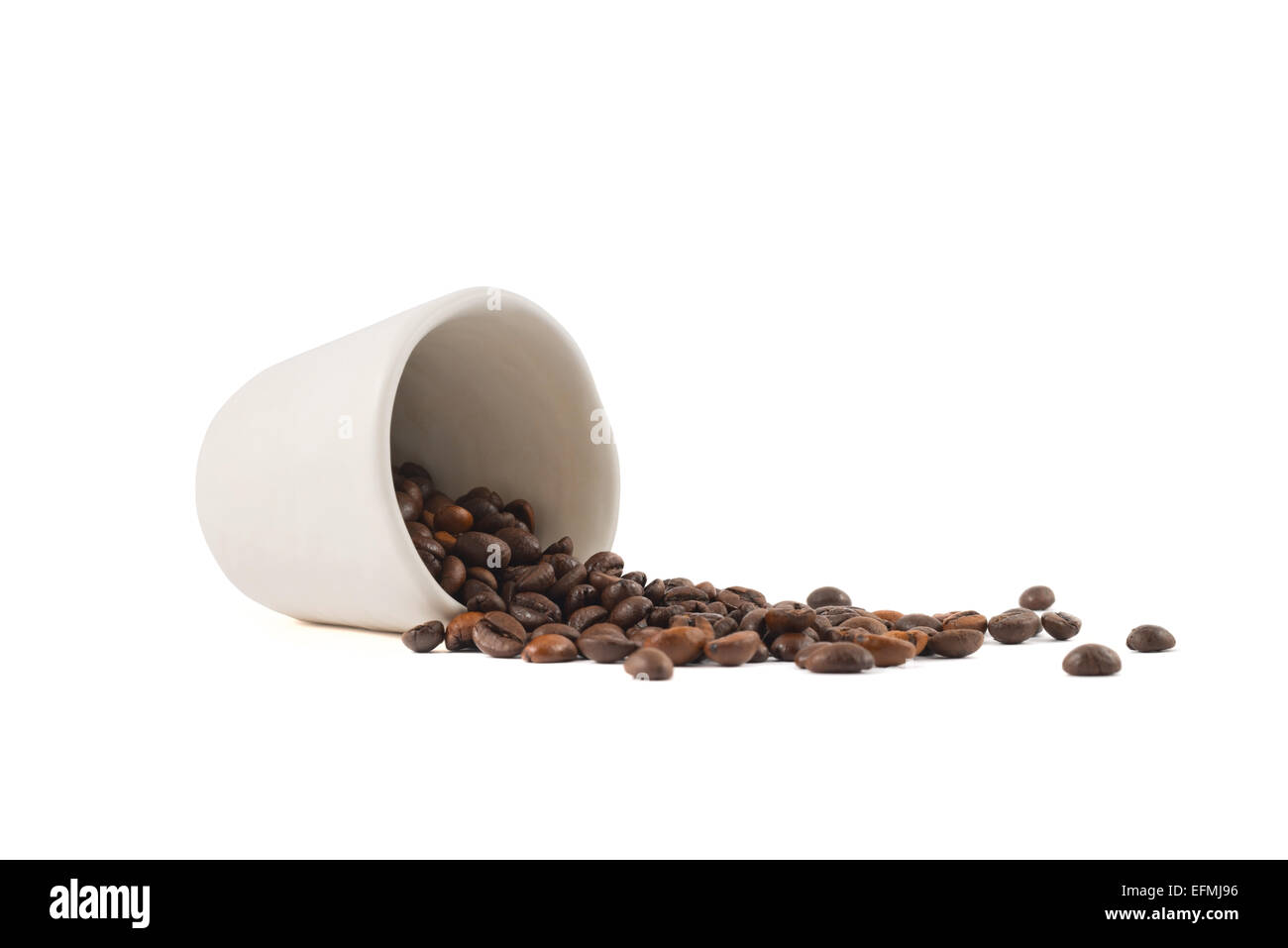 Spilled coffee beans from the cup isolated Stock Photo - Alamy