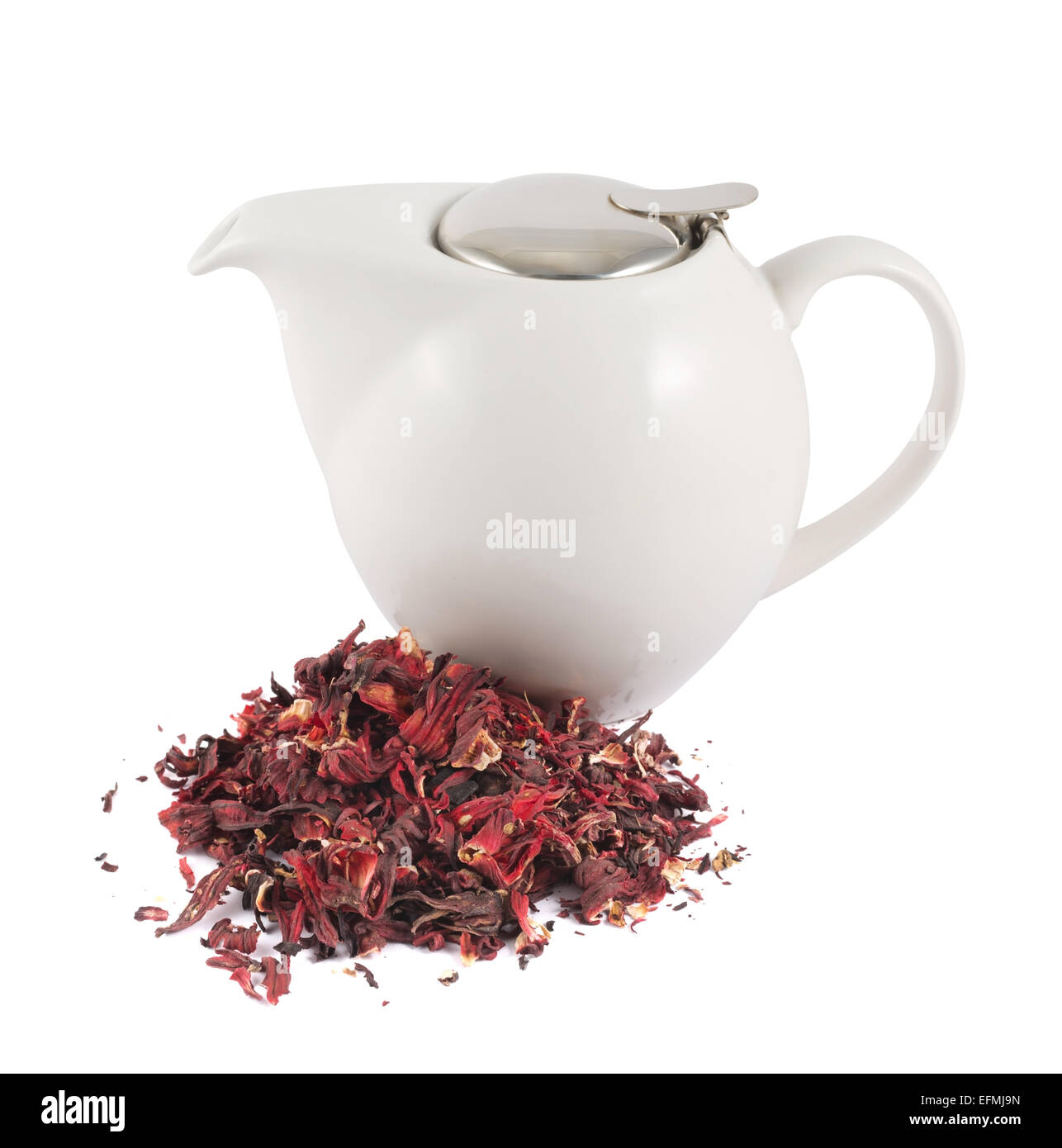 Ceramic teapot next to pile of tea isolated Stock Photo - Alamy