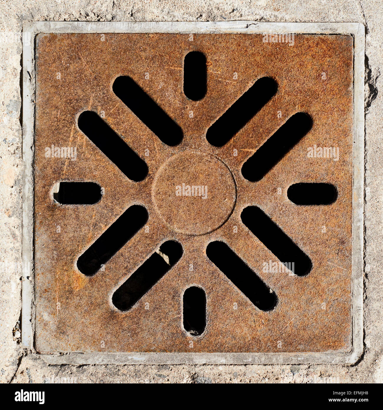 Rusty drain grate in concrete floor Stock Photo - Alamy