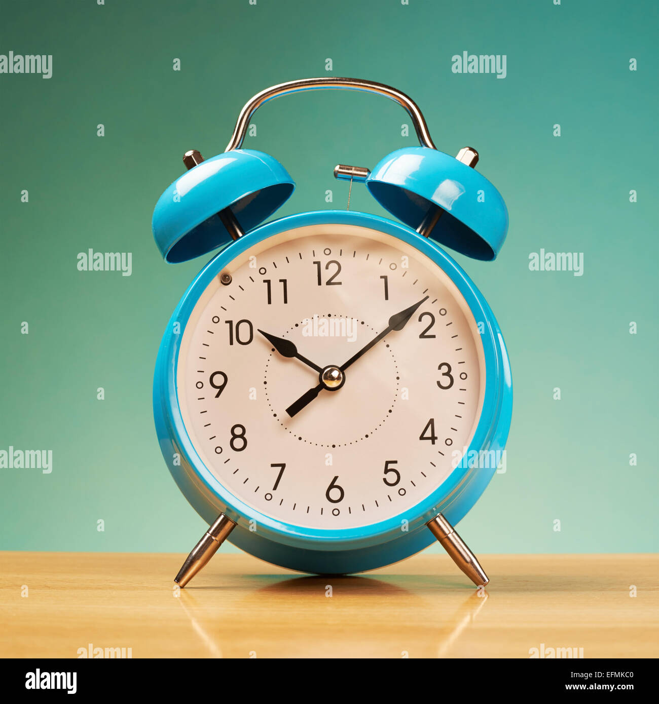 Blue alarm clock Stock Photo - Alamy