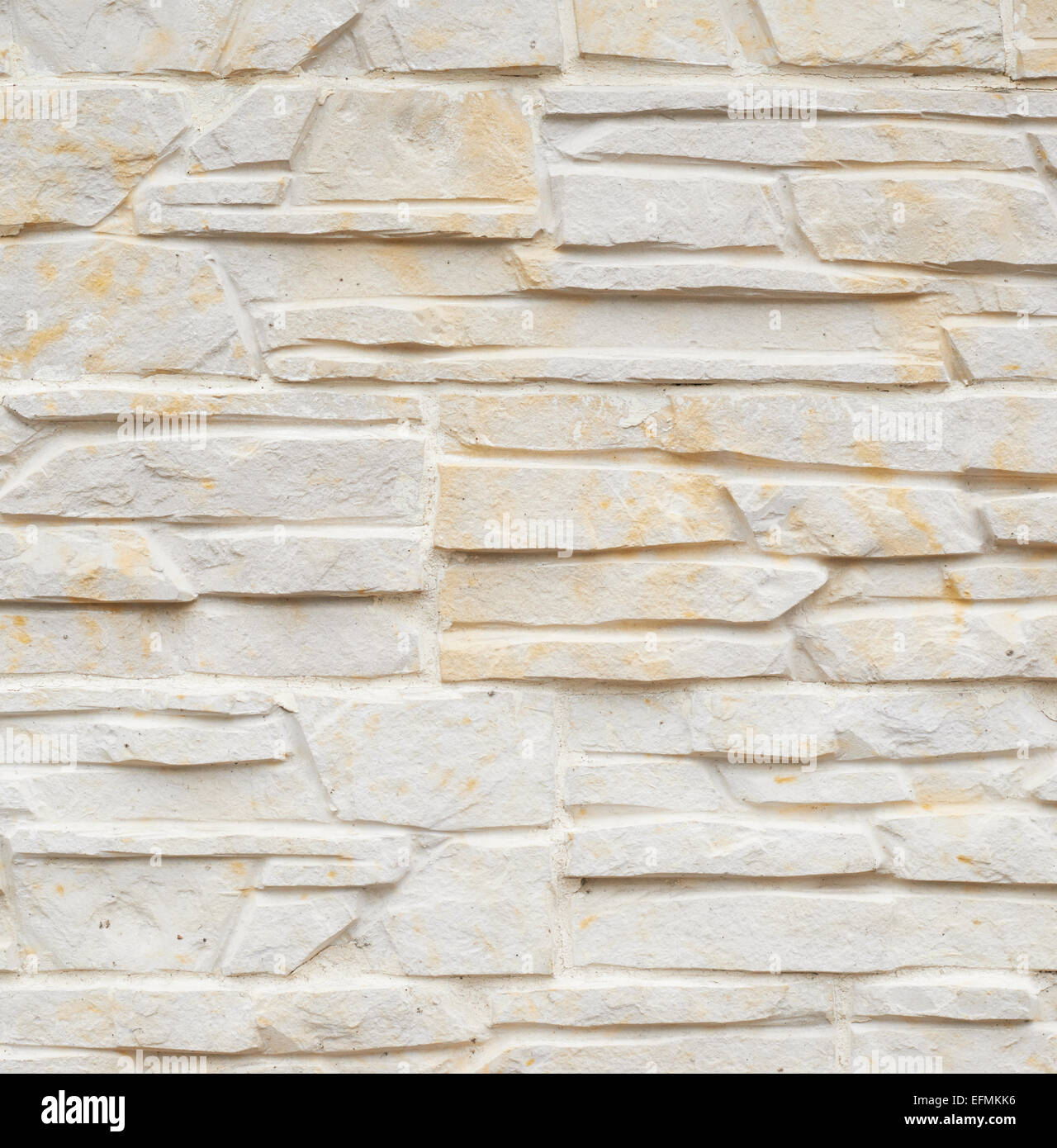 Wall of carved limestone bricks Stock Photo - Alamy