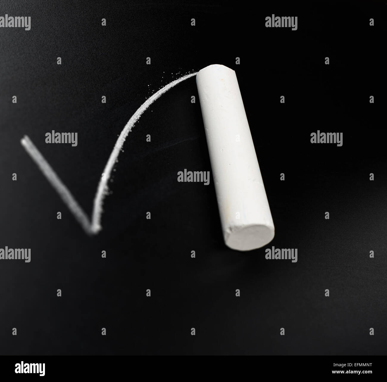 Drawn yes tick sign next to a piece of chalk Stock Photo - Alamy