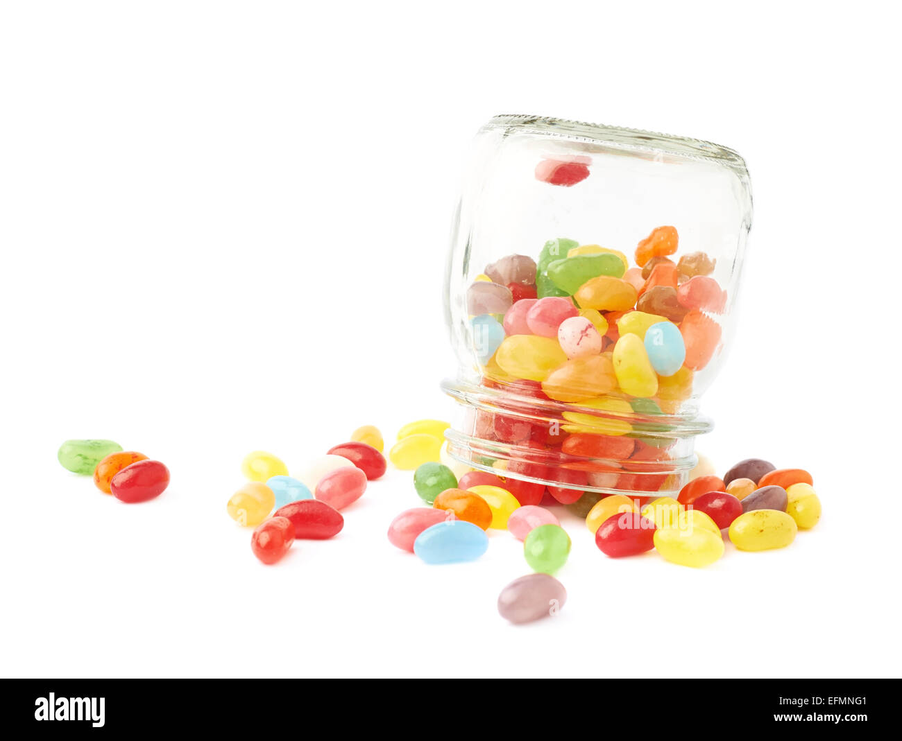 Jelly bean candies spilled out of jar Stock Photo - Alamy