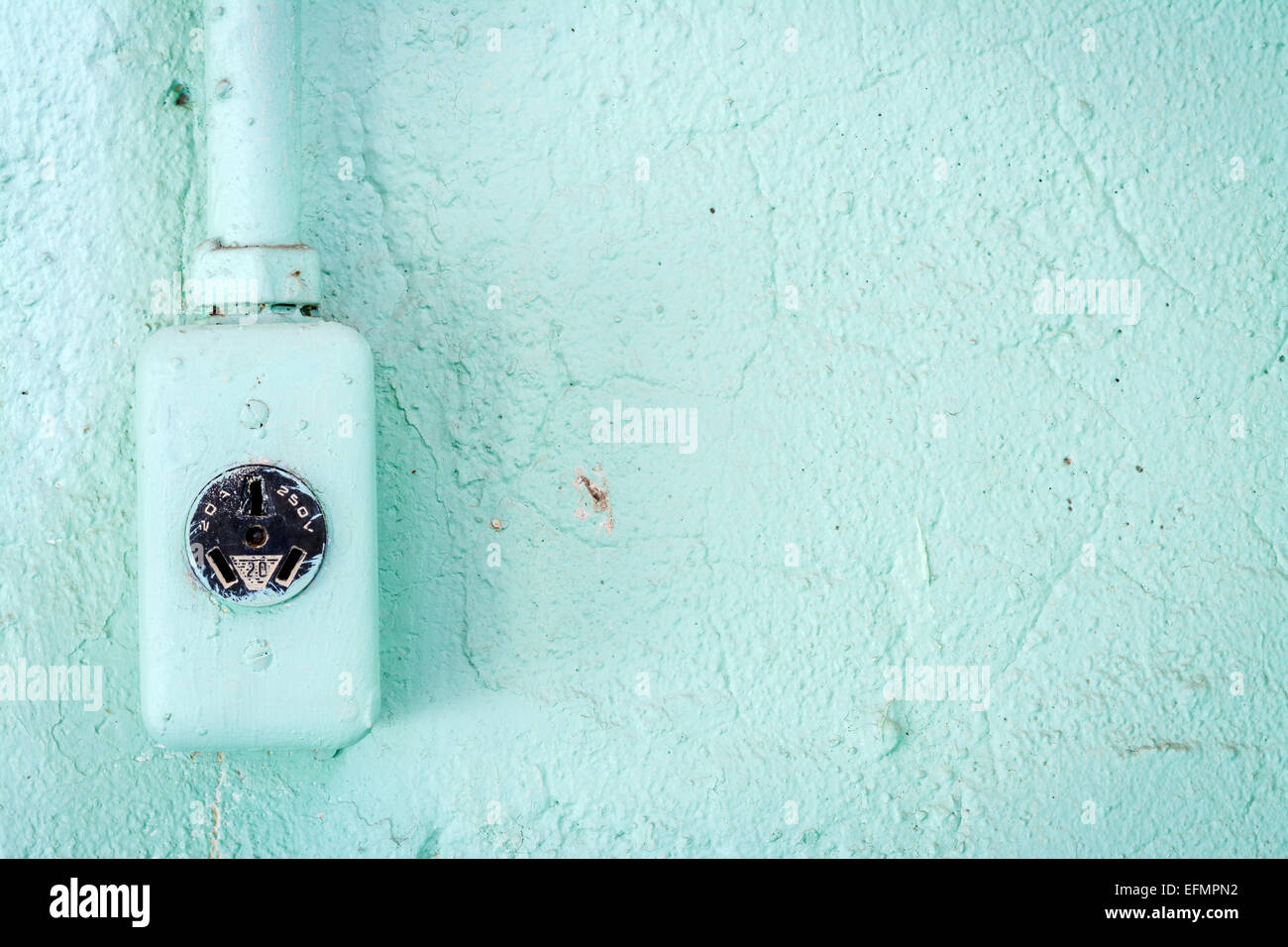 Antique electrical outlet that is painted Stock Photo - Alamy