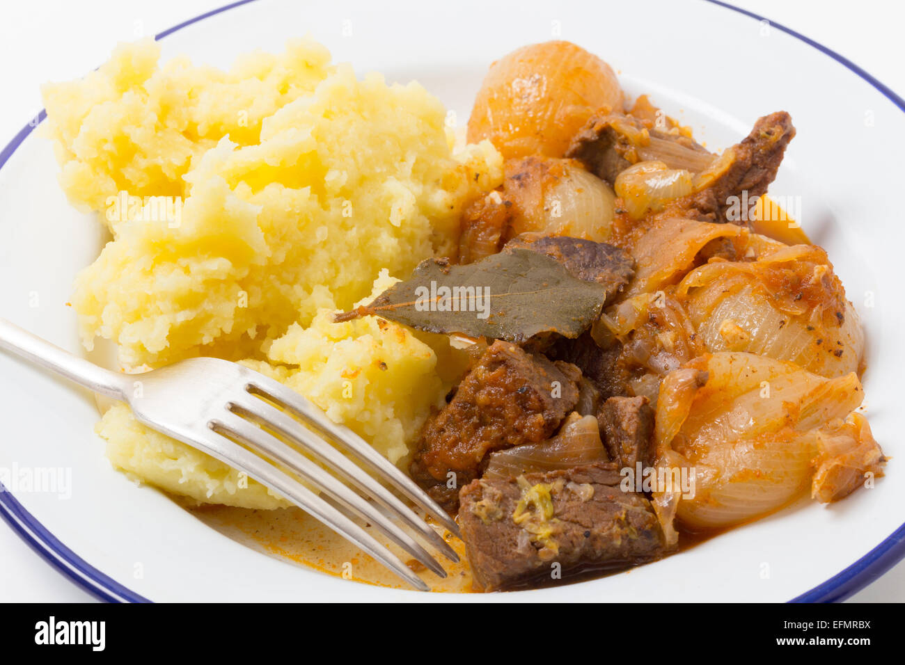 Greek traditional beef stifado, a meat and onion stew, served with ...