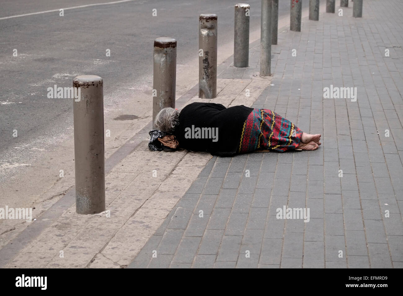 A homeless person sleeping in the street in West Jerusalem Israel Stock ...