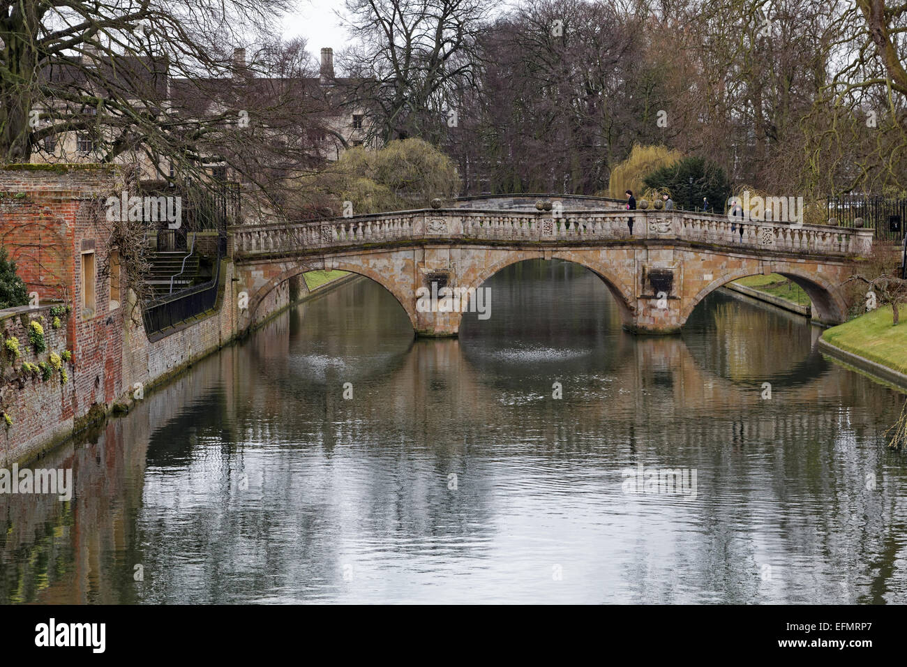 People stroll across a bridge at the River Cam, Cambridge, England, UK ...