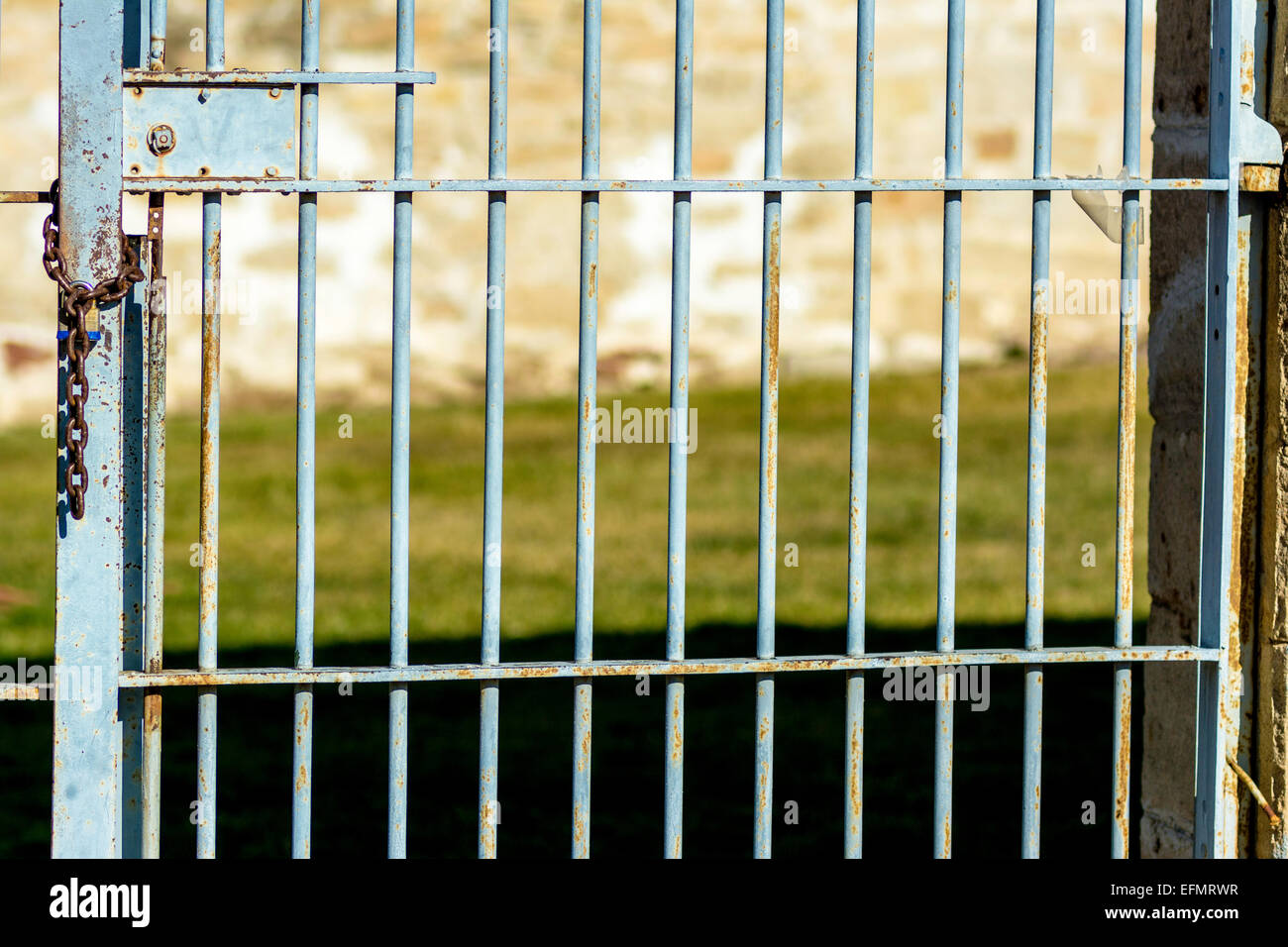 Out side prison bars with chain and rust Stock Photo - Alamy