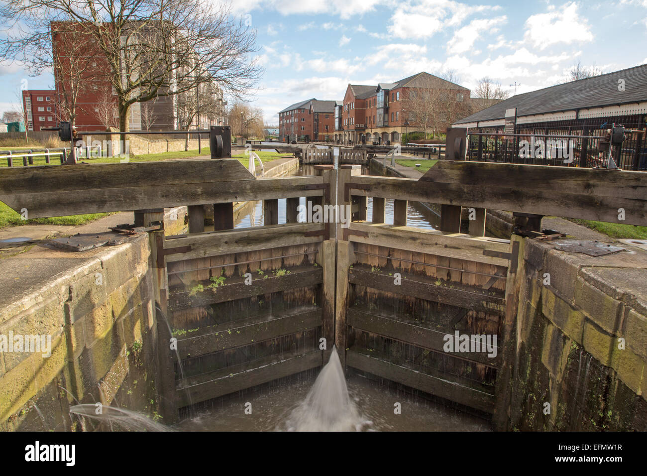 A lock on the Leeds Liverpool canal in the town of Wigan; near Wigan ...