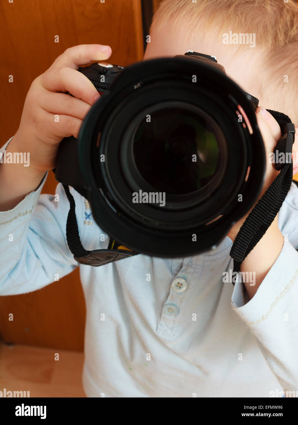 Happy childhood. Boy child kid playing with camera. Preschooler taking ...