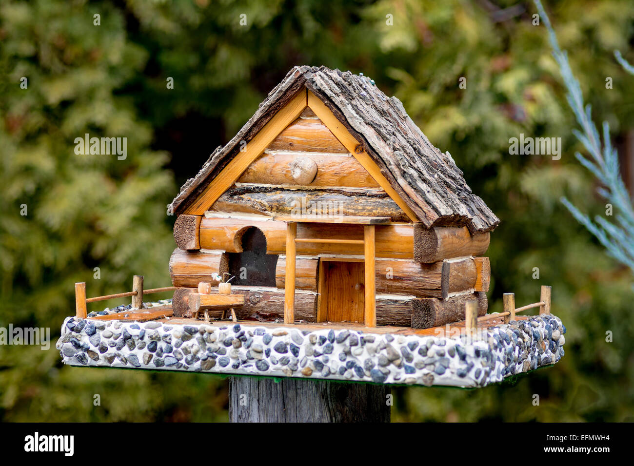 Bird house on a post in nature Stock Photo - Alamy