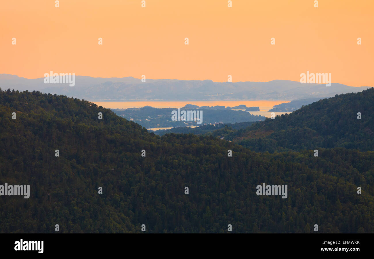 Panoramic view from hill of Bergen and fjord landscape red sky sunset ...