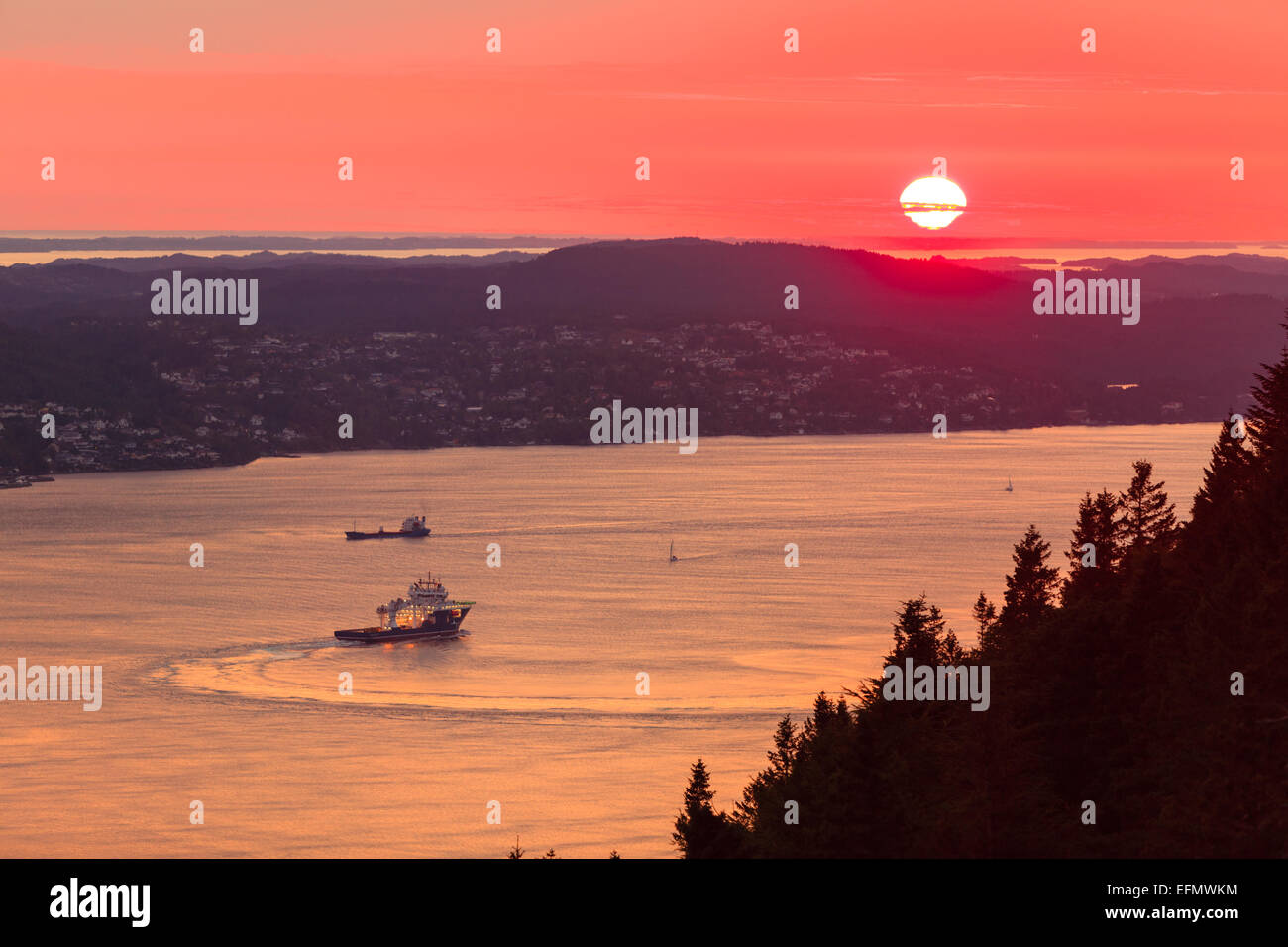 Panoramic view from hill of Bergen and fjord landscape red sky sunset ...