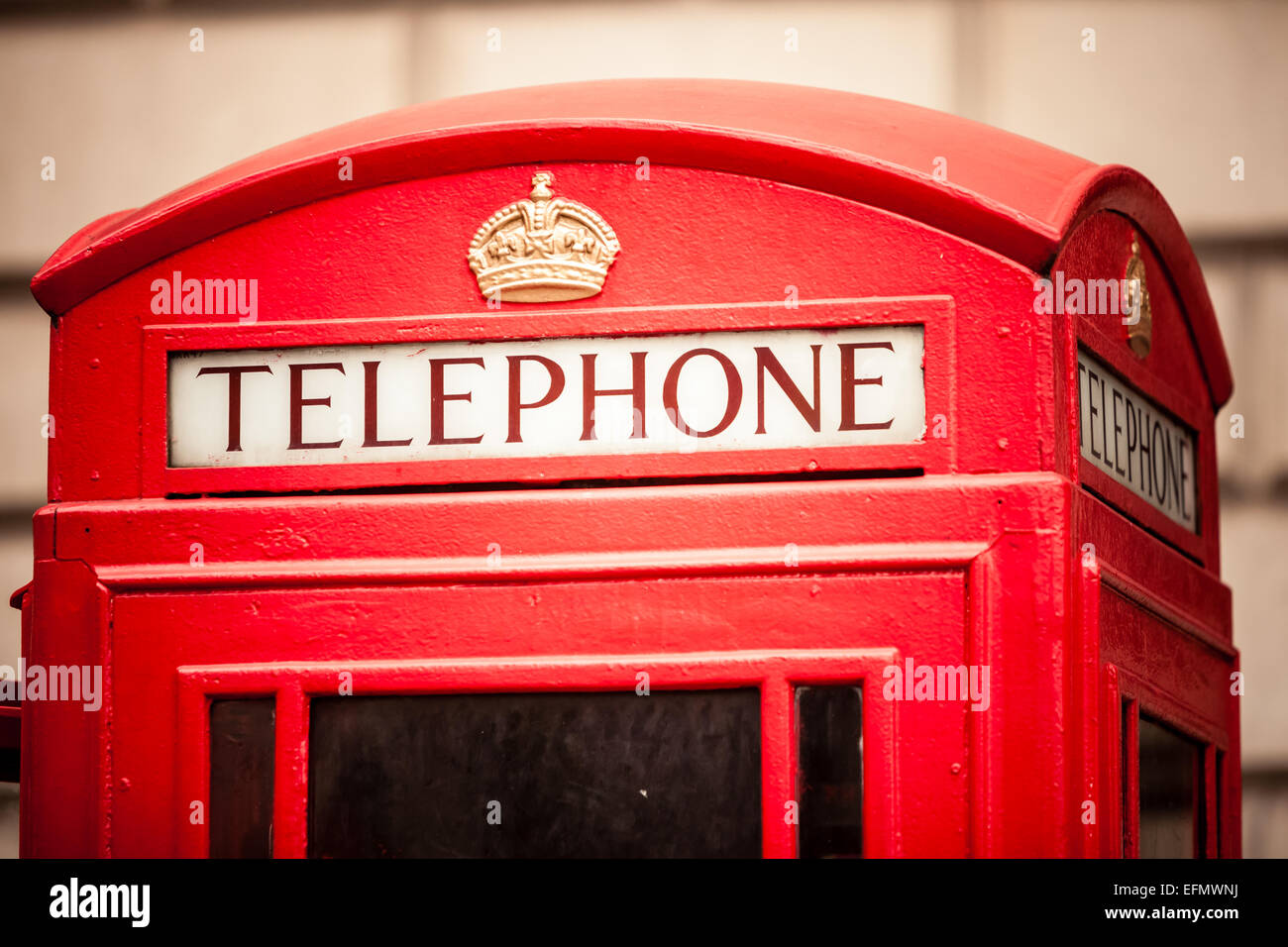Closeup traditional red telephone box booth or public payphone in ...