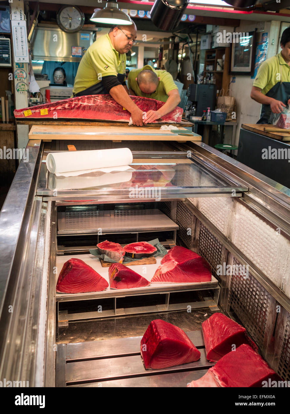 Men cutting tuna fish at Tsukiji market Stock Photo - Alamy