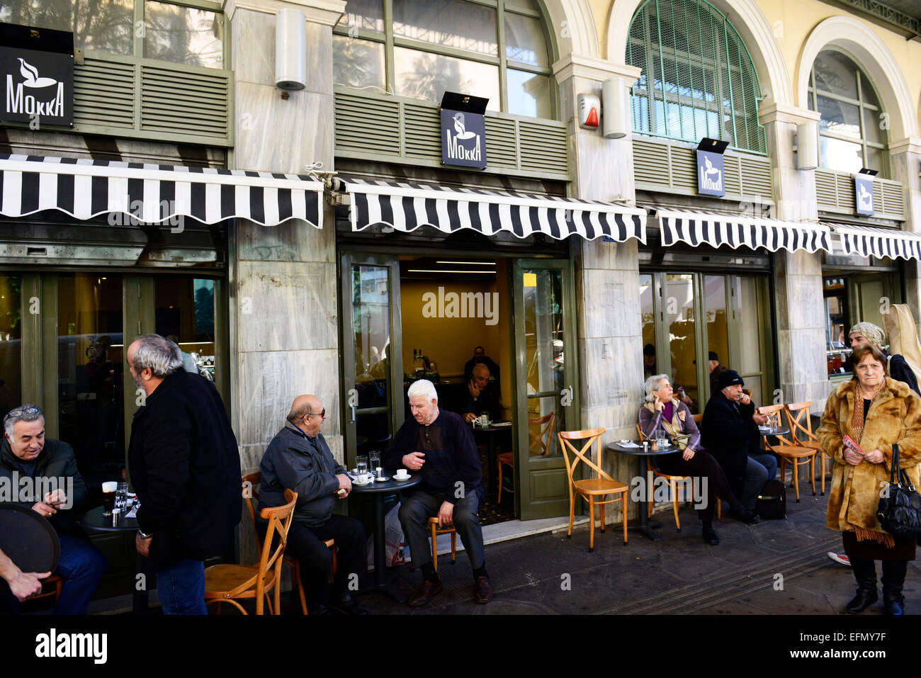 Greeks enjoying local Greek coffee in a popular cafe near the Athens ...