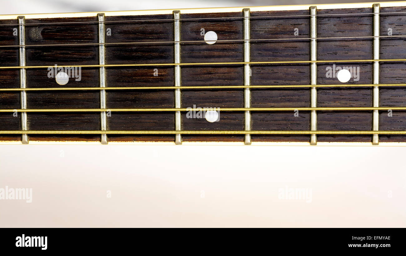 Close up of a guitar neck with frets Stock Photo - Alamy