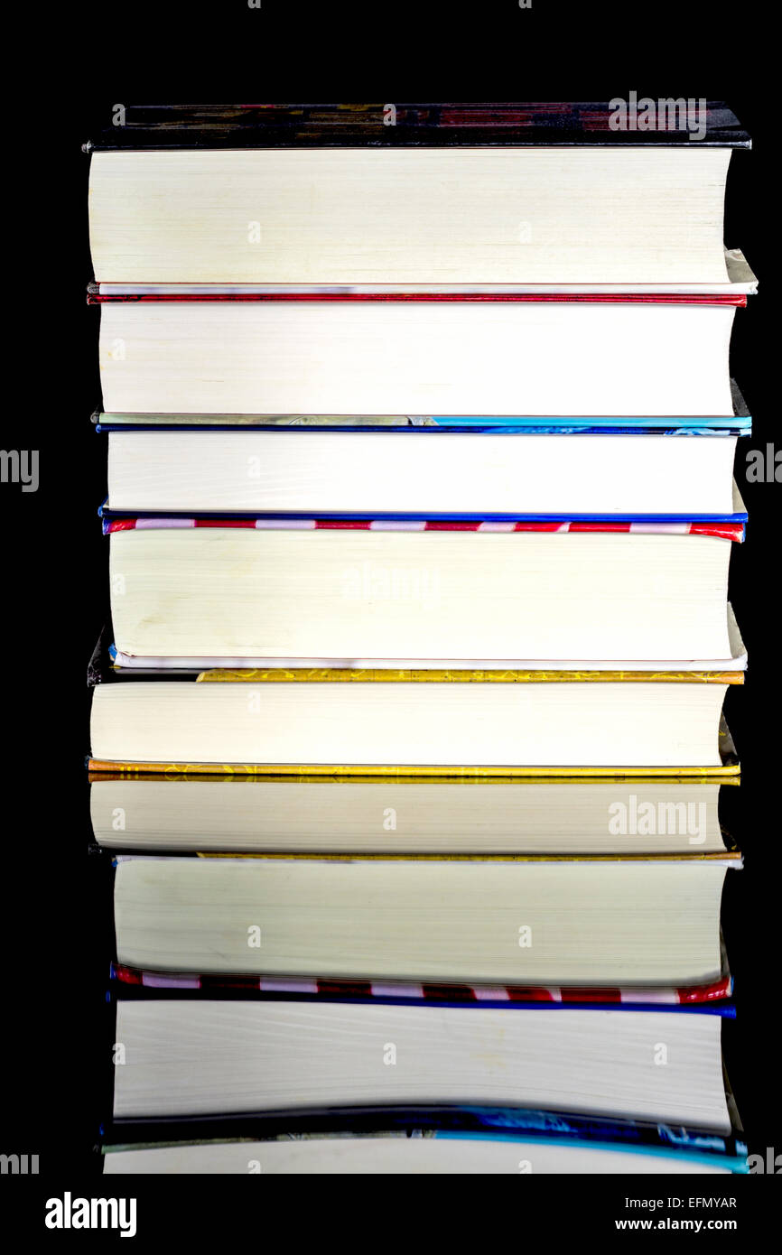 Stack of old books and reflection Stock Photo - Alamy