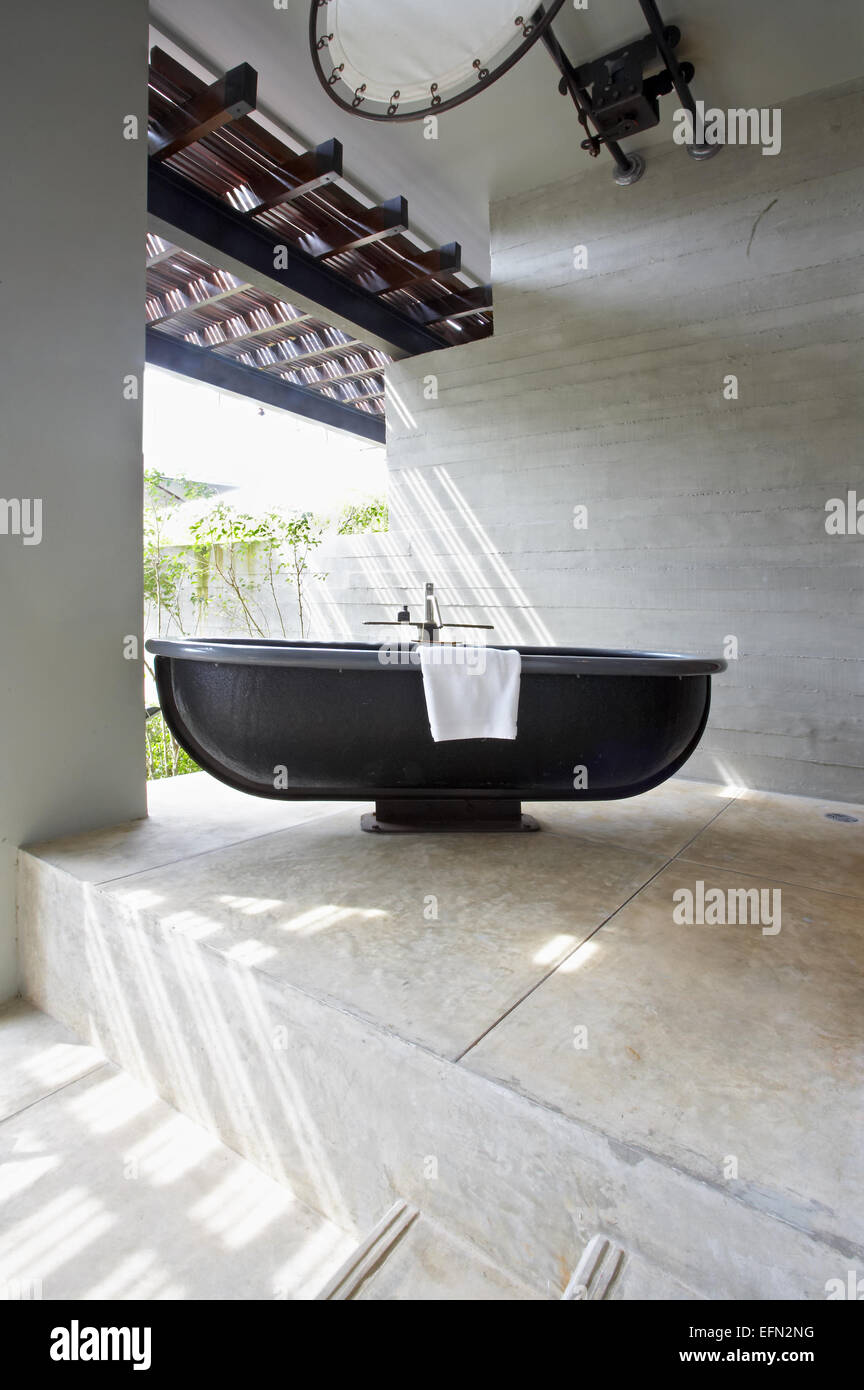 View of summerhouse terrace with black bath in a middle Stock Photo - Alamy