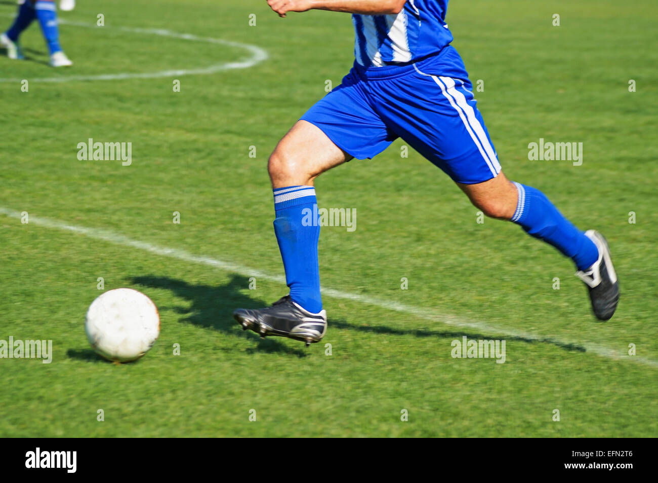Football player blue uniform hi-res stock photography and images - Alamy