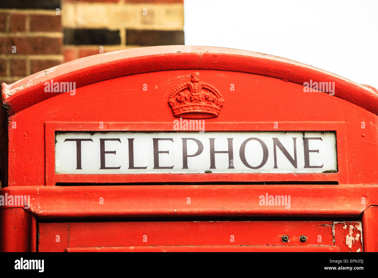Closeup traditional red telephone box booth or public payphone in ...