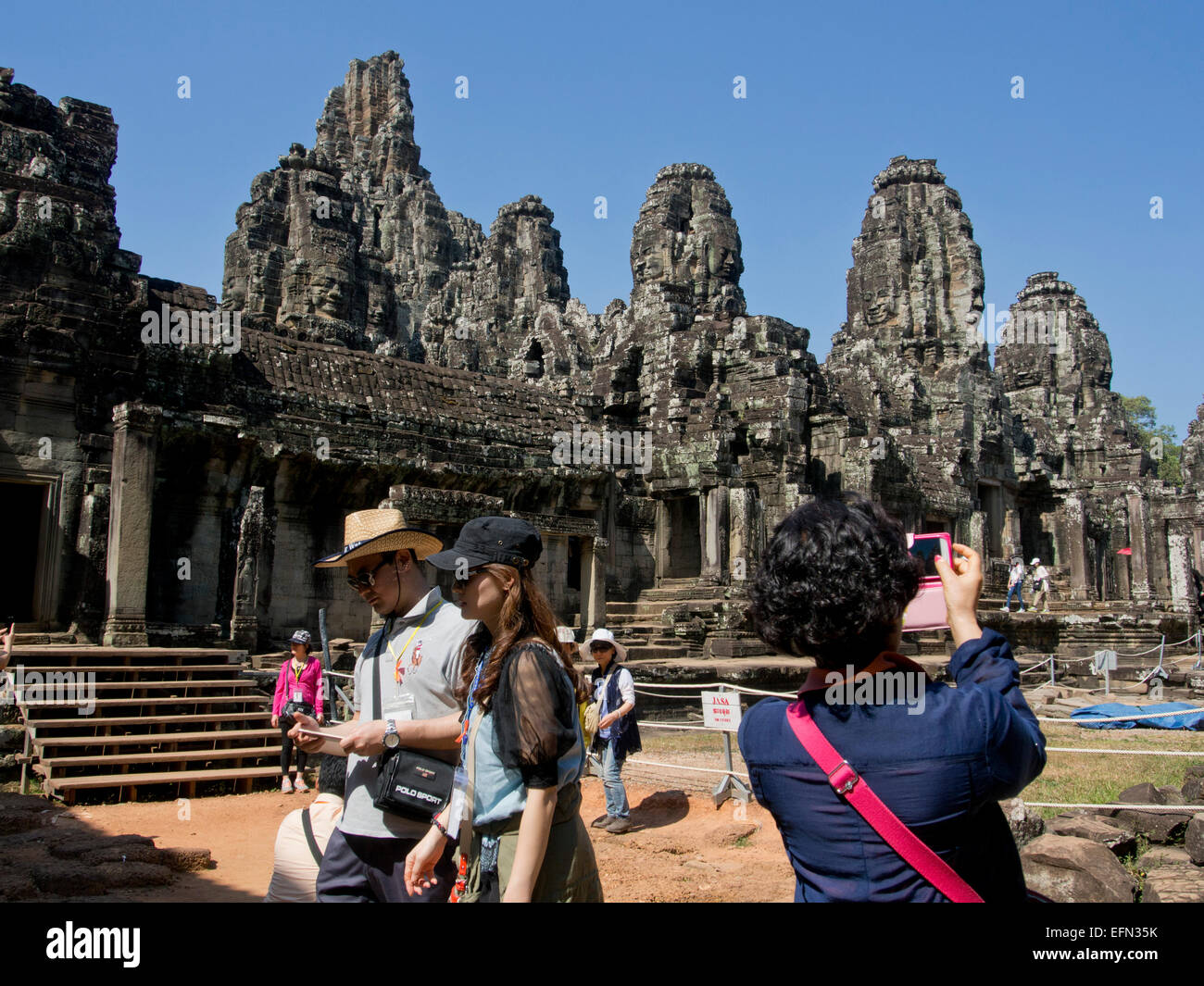 Tourists visit the temples at the Angkor Wat archaelogical park ...