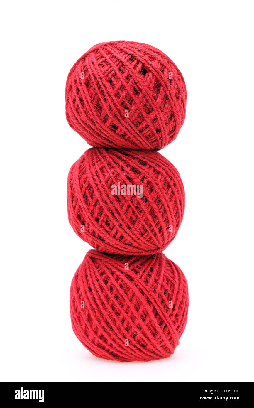 Ball of red threads on white background Stock Photo - Alamy