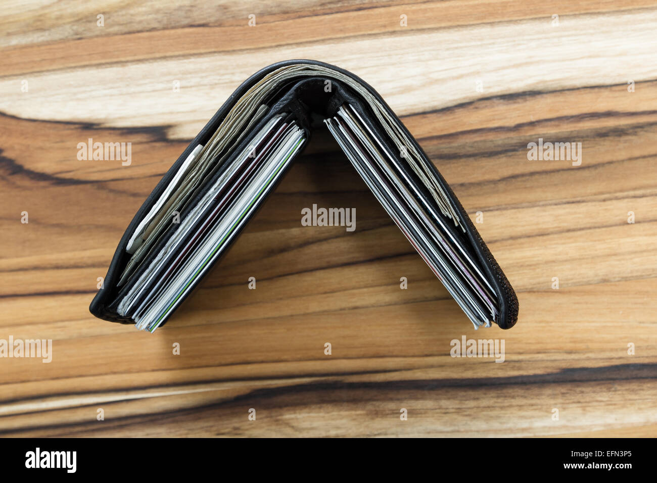 Wallet filled with papers hi-res stock photography and images - Alamy