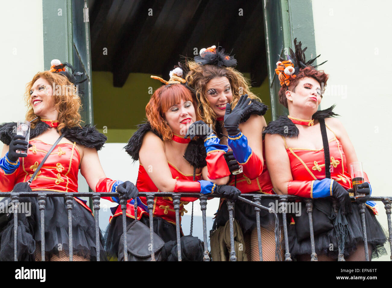 Carnival goers on balcony at Las Palmas Carnival, Gran Canaria Canary ...