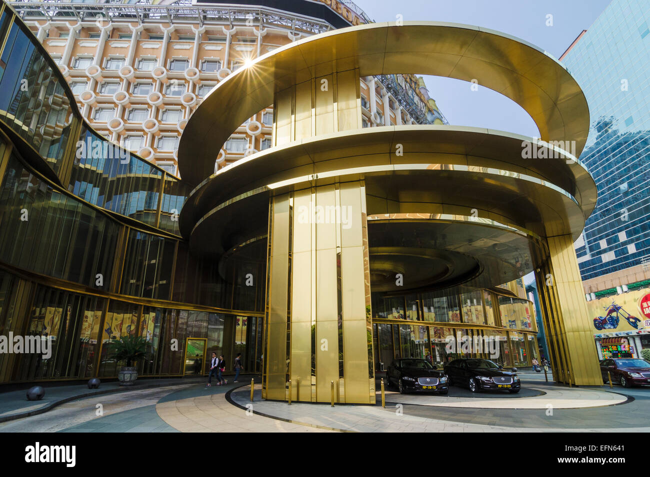 Luxury hotel cars parked outside the gold entrance to the Hotel Lisboa ...