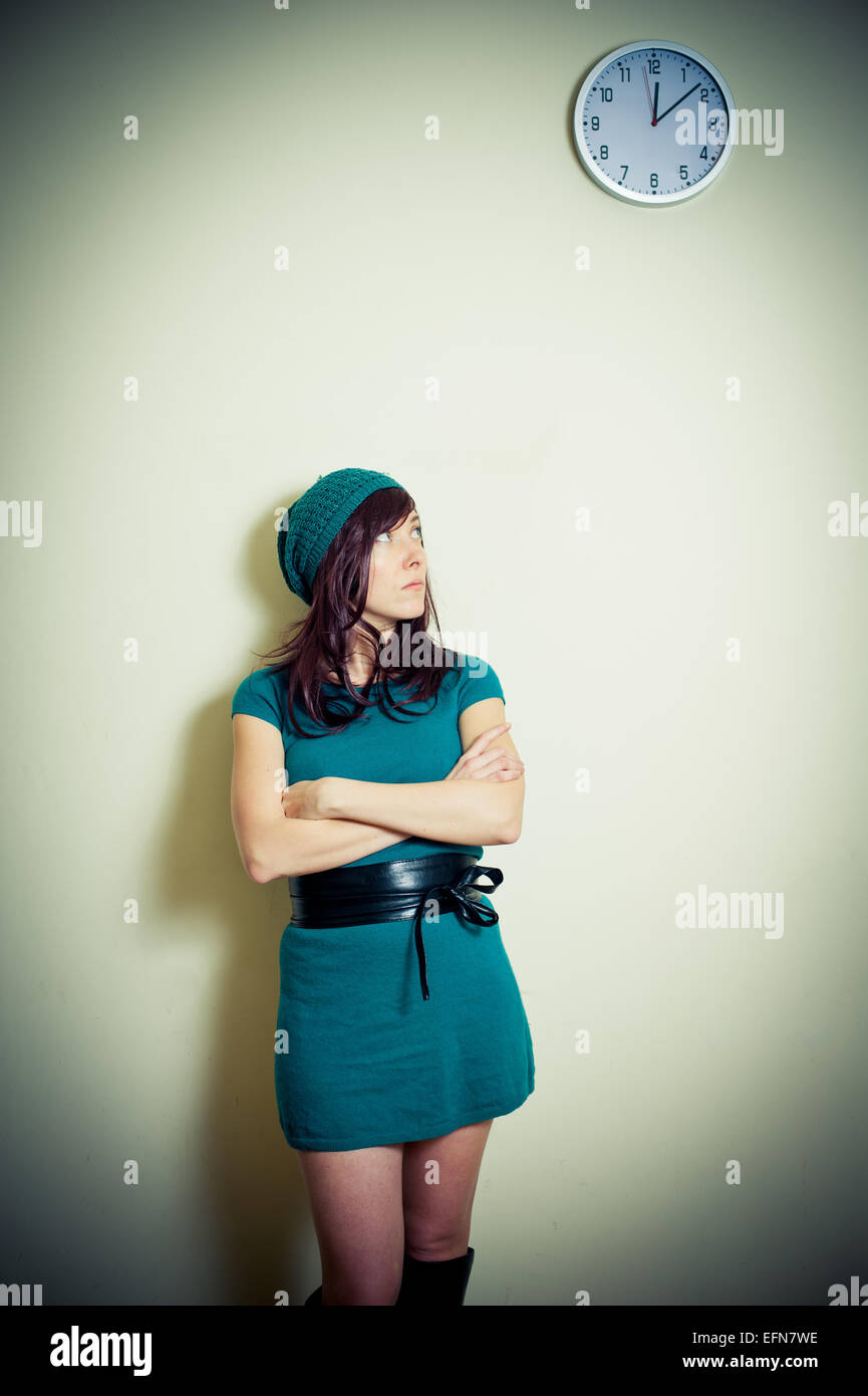 Woman and clock hi-res stock photography and images - Alamy