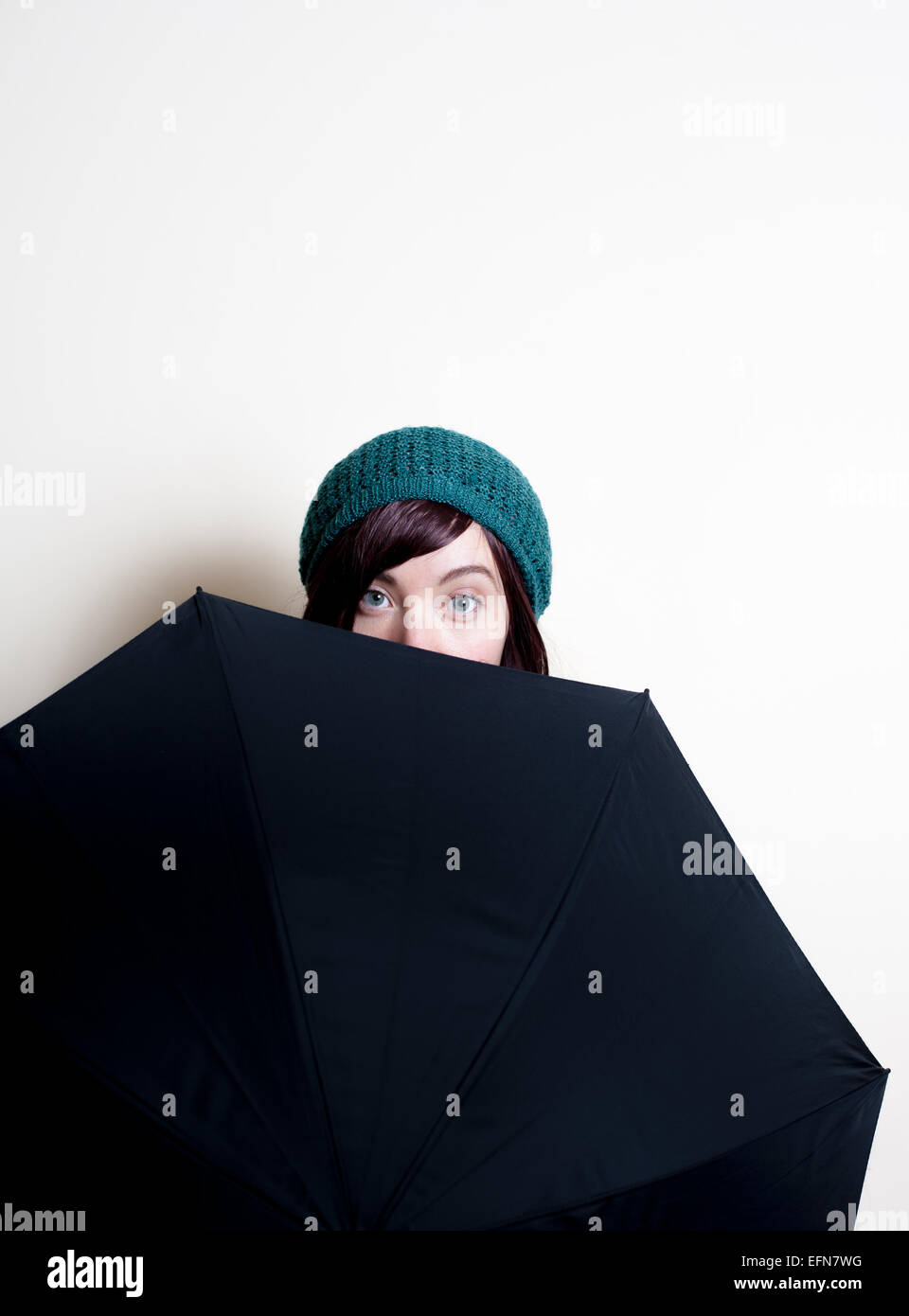 Woman face behind hat hi-res stock photography and images - Alamy