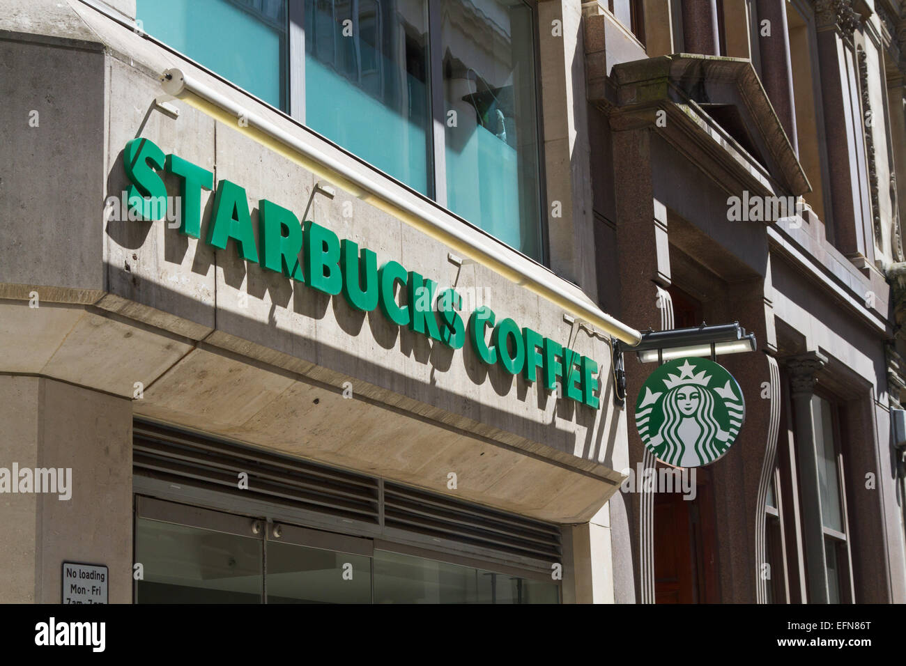 Starbucks Coffee sign above shop in the City of London Stock Photo - Alamy