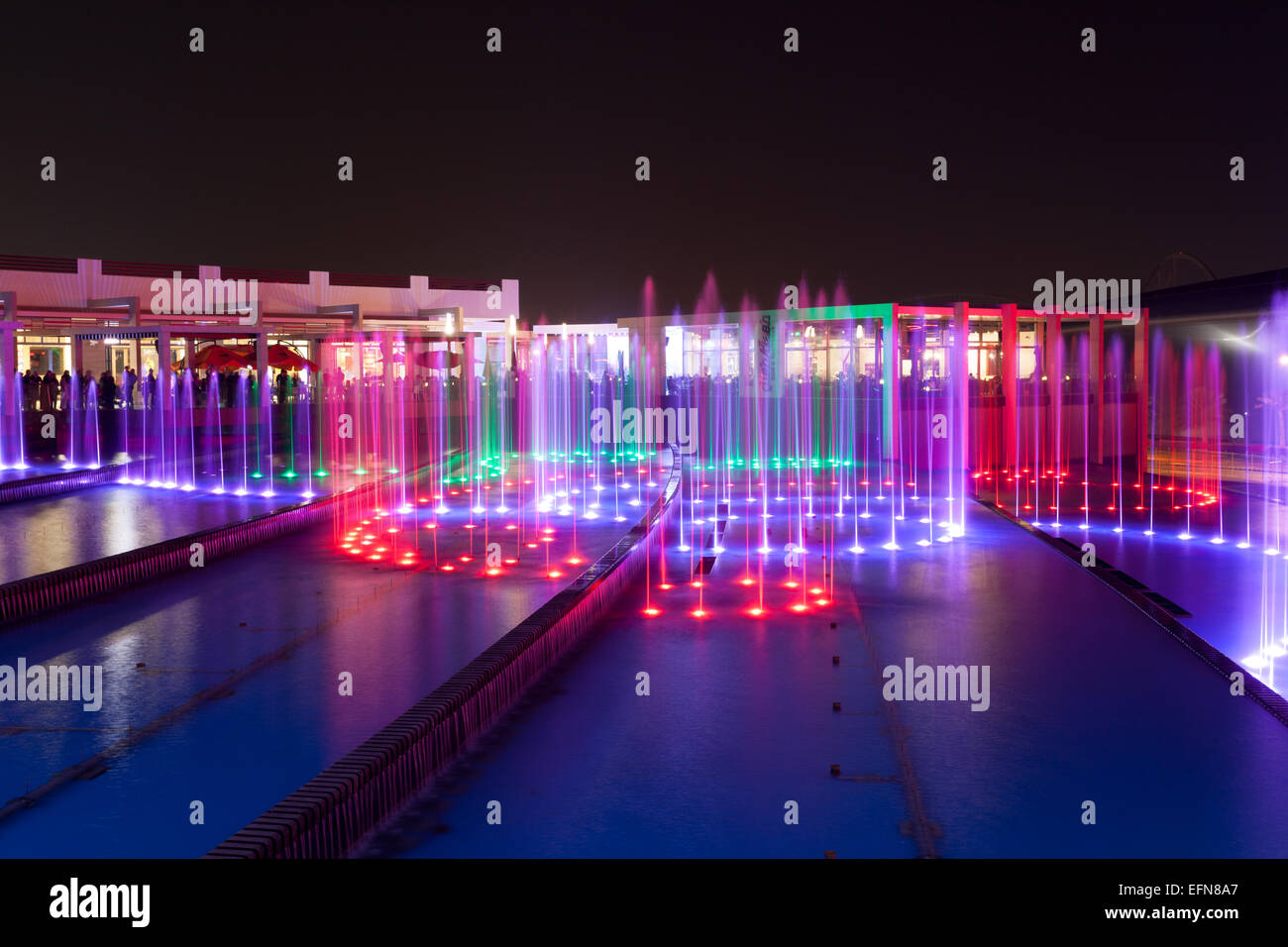 Fountain at the Ferrari World Theme Park illuminated at night Stock ...