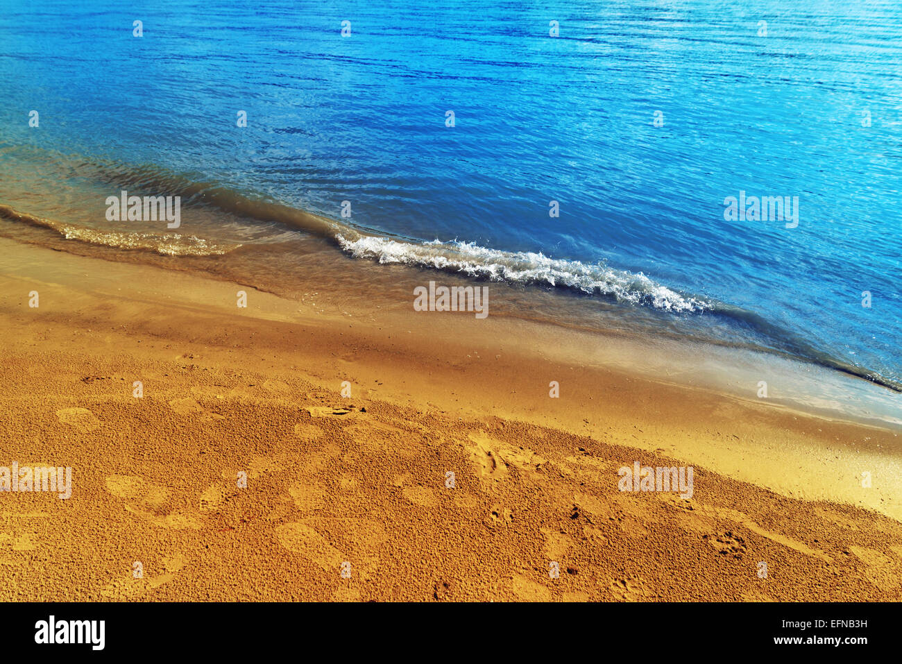 Water splashing river bank and sand beach Stock Photo - Alamy