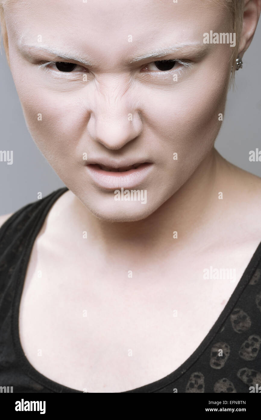 angry aggressive girl in black lenses Stock Photo - Alamy