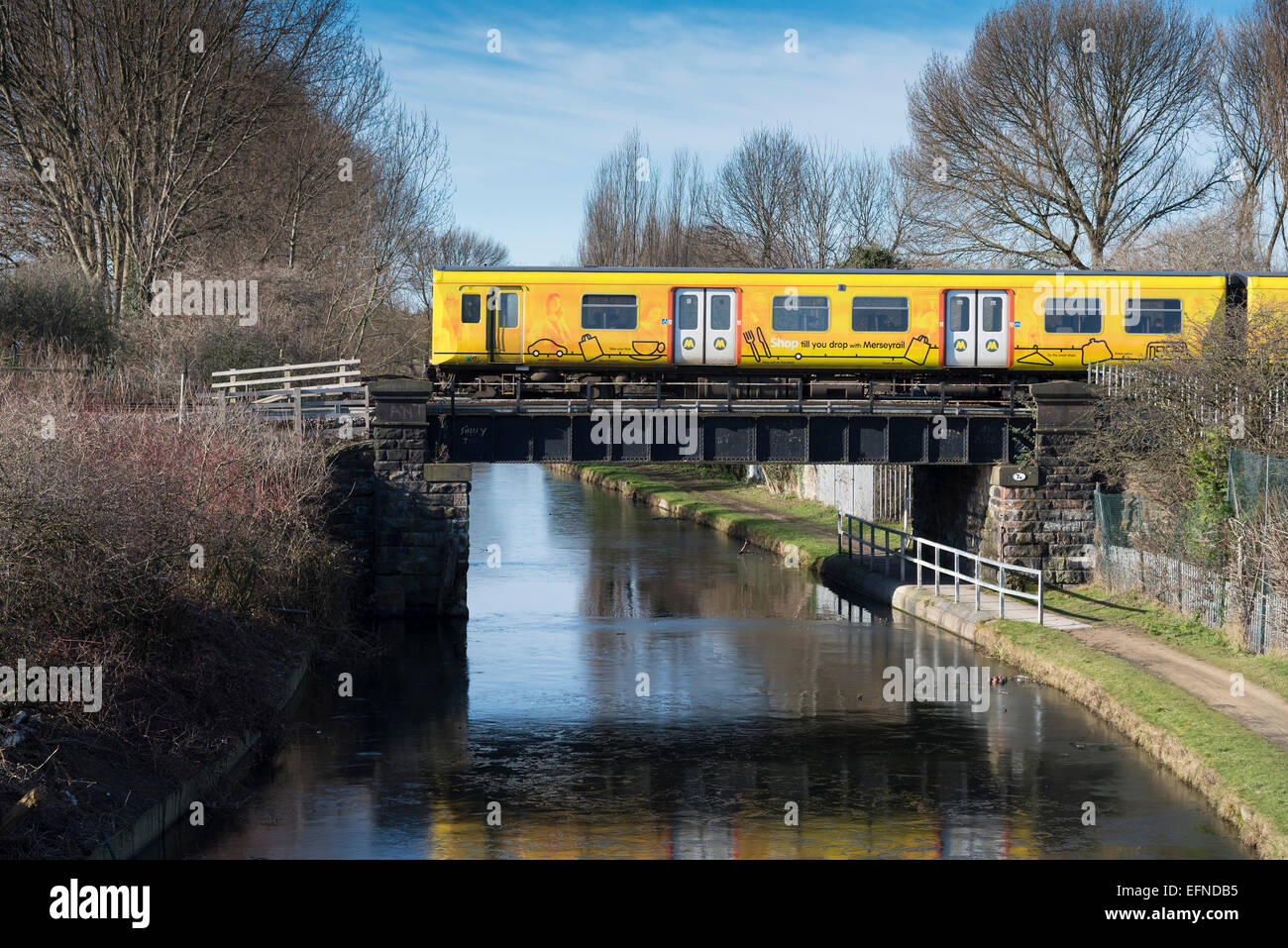 Merseyrail Electrics train at Old Roan crossing the Leeds Liverpool ...