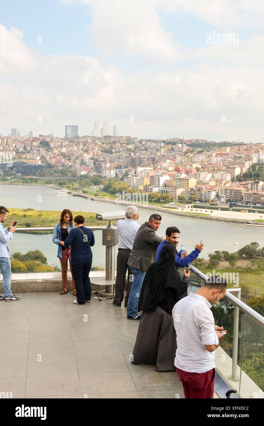 Tourists enjoying view on hillside at top of cable car between Pierre ...