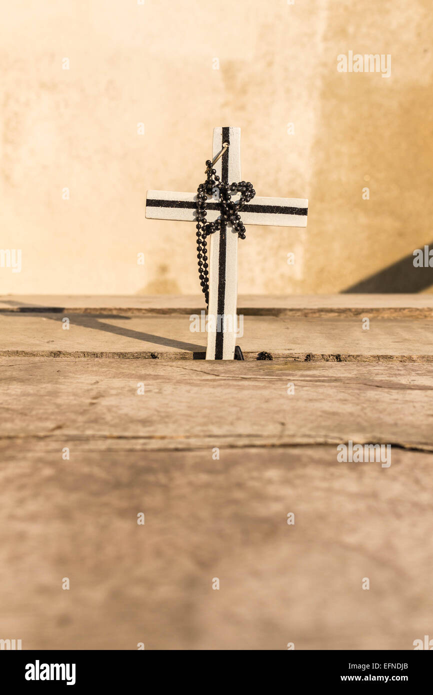 Wooden cross on chain hi-res stock photography and images - Alamy