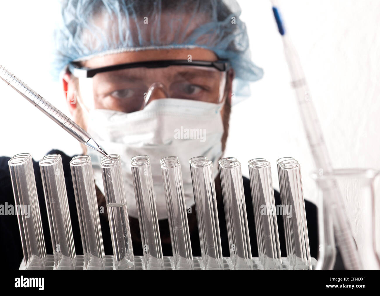 Laboratory technician filling test tubes hi-res stock photography and ...