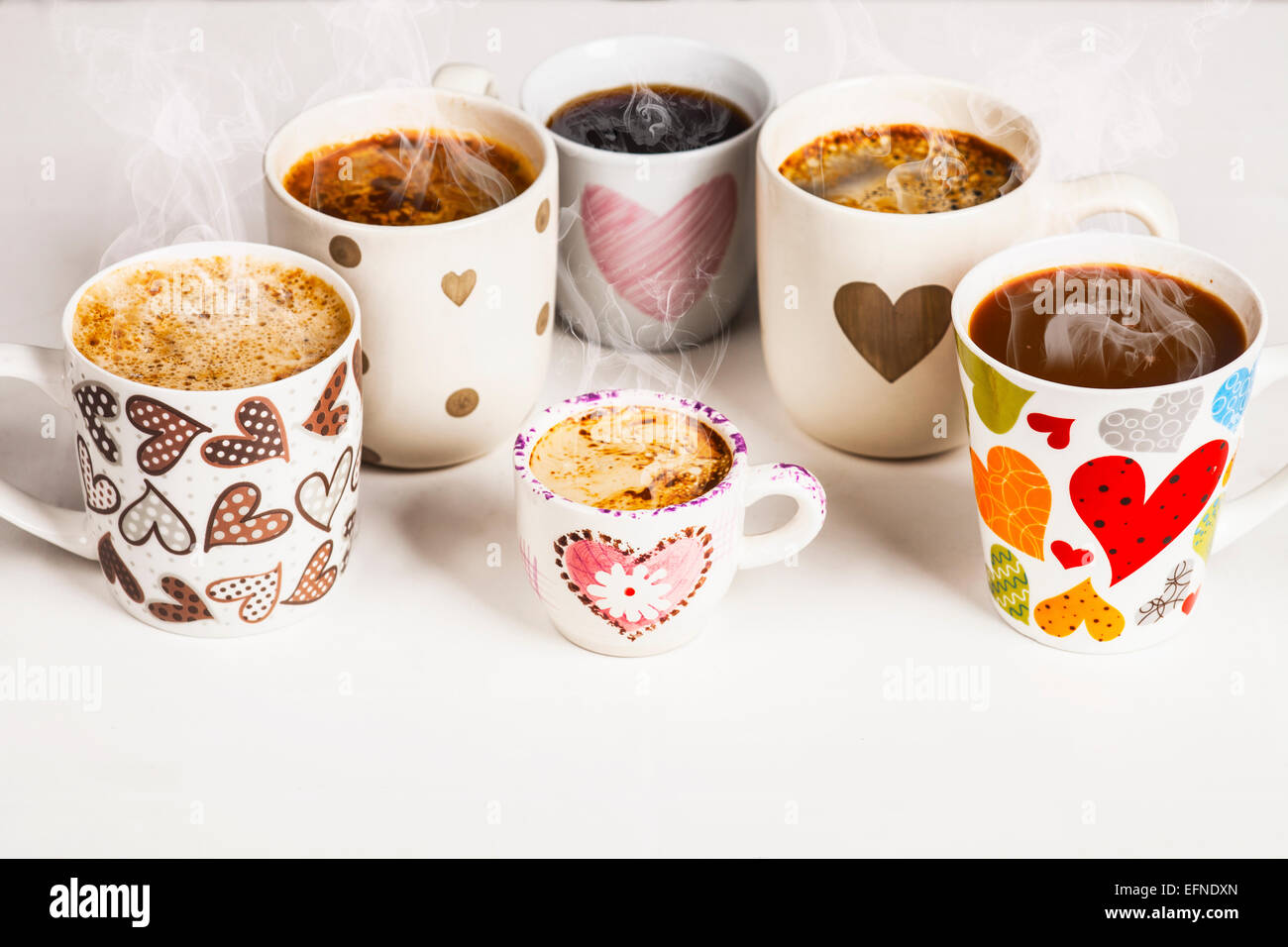 Lots of coffee in different cups with hearts Stock Photo - Alamy